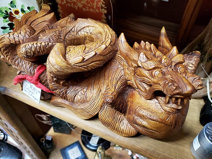 This wooden dragon didn't breathe fire, but it certainly ignites imagination. Intricate carving transforms ordinary wood into a mythical beast worthy of any collection.