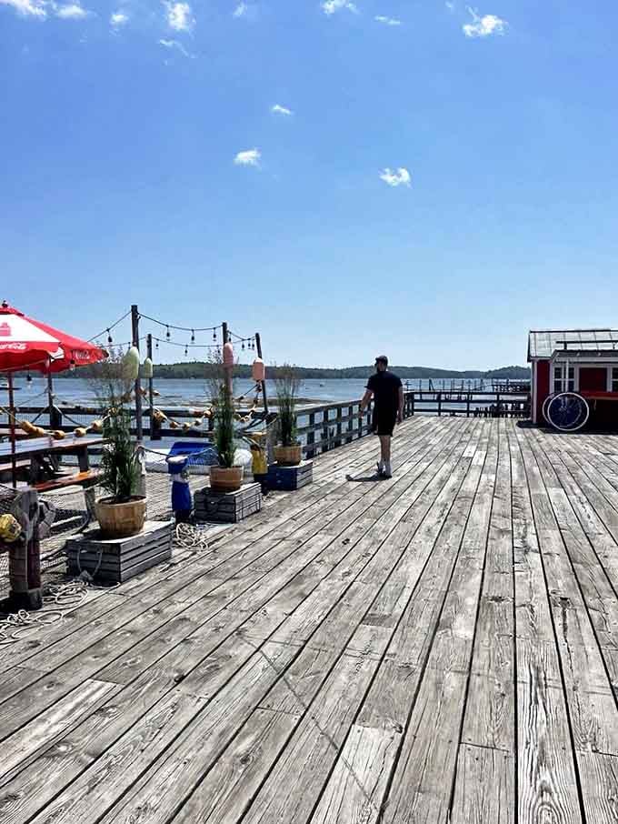 Where the ocean becomes your dining room. The weathered wooden deck offers front-row seats to nature's greatest show while you feast on her bounty.