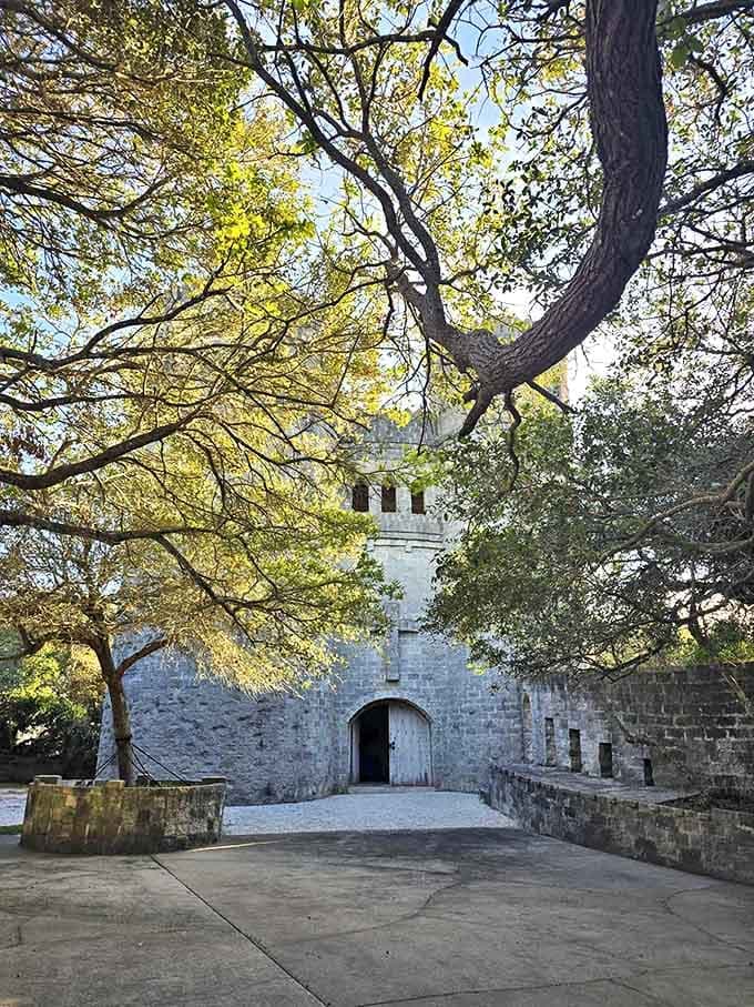 The approach to Castle Otttis feels like entering another realm&mdash;stone walls frame a simple doorway while Florida trees create a natural cathedral ceiling above.