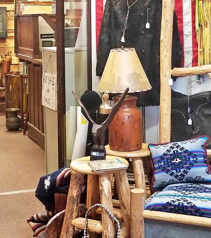 Rustic log furniture paired with a pottery lamp creates the perfect Montana aesthetic&mdash;where wilderness meets warmth and comfort.