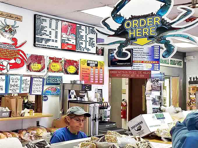 The ordering counter – where dreams come true and life-changing food decisions are made under the watchful eye of crab decorations.