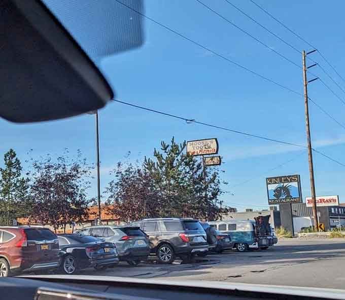 Even from the parking lot, that sign beckons like a lighthouse for the hungry. Cars gather like devoted followers at a temple of taste.
