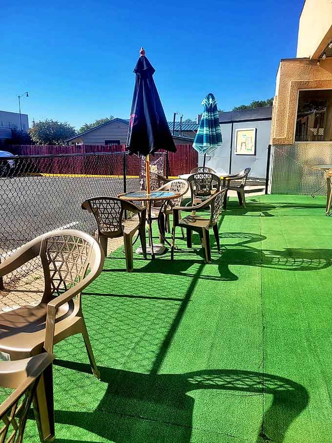 Outdoor seating with artificial turf &ndash; because sometimes you want your eggs with a side of Colorado sunshine and casual vibes.
