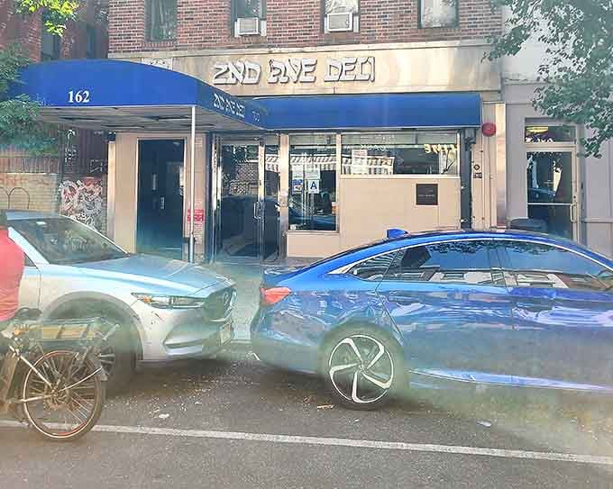 Even the cars parked outside seem to be smiling, knowing their owners are inside experiencing sandwich nirvana.