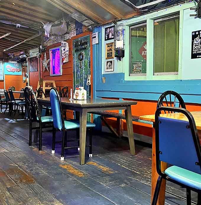 Technicolor walls frame rustic wooden tables where countless stories have been shared over platters of seafood and cold drinks.