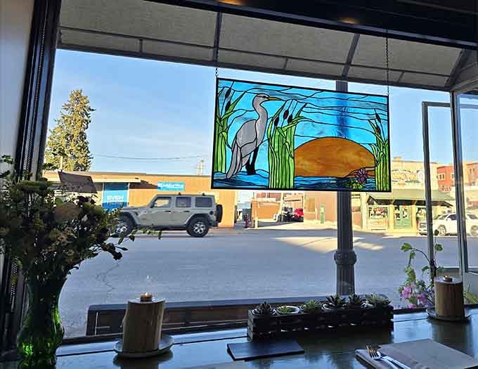 Beautiful stained glass brings artistry to the dining experience, filtering light the way the kitchen filters influences into something uniquely Skogen.