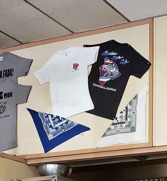 T-shirts on display aren't just souvenirs &ndash; they're membership cards to an exclusive club of those who've conquered the Hawaiian Style Cafe experience.