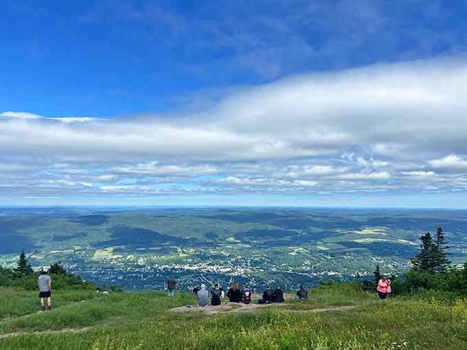Summit panoramas stretch for miles, offering views of five states and approximately one million reasons to smile.