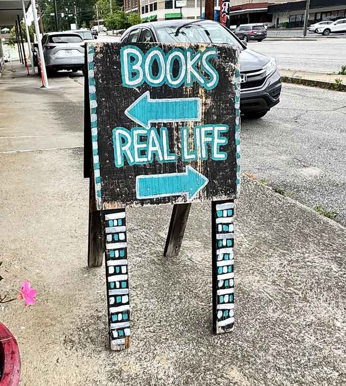 The charmingly weathered sign outside perfectly captures the authentic, unpretentious spirit waiting inside for book lovers.