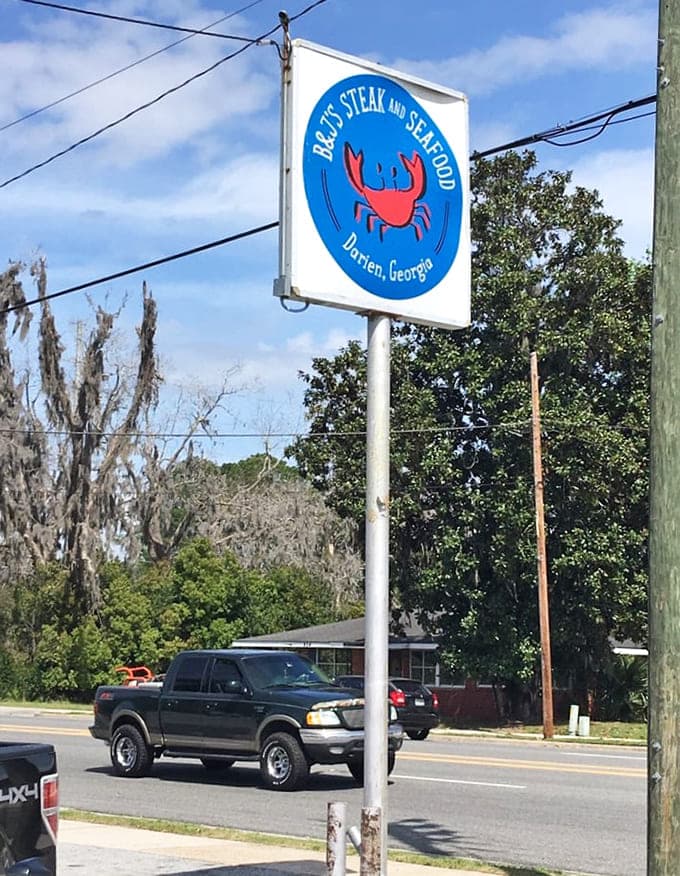 That cheerful crab logo beckons travelers off Highway 17 like a lighthouse guiding hungry ships safely to shore.