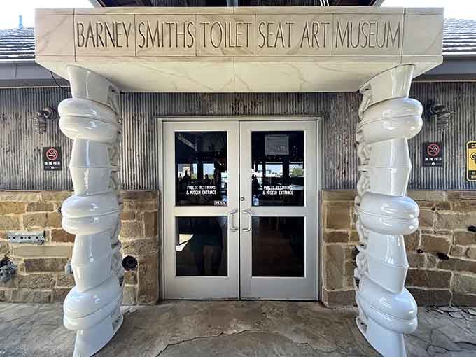 Giant toilet columns frame the entrance like the Parthenon, if ancient Greeks had better plumbing humor.