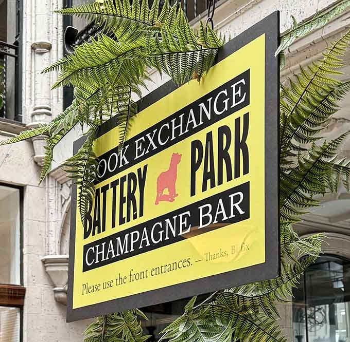 That bright yellow sign pointing you toward literary bliss and sophisticated sipping awaits.