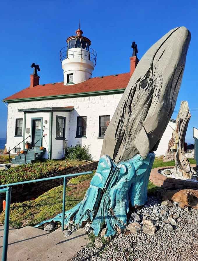 A whale sculpture reminds you that these waters have always belonged to creatures much larger than lighthouse keepers.