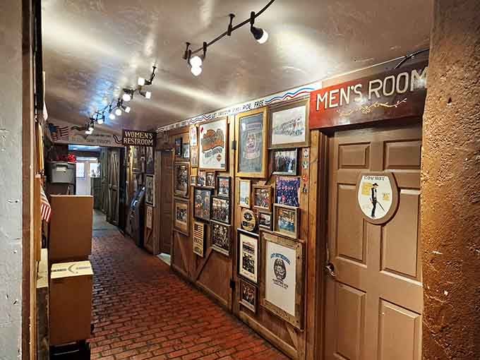 The restroom hallway decorated with enough memorabilia to keep you entertained during the inevitable wait after those street tacos.