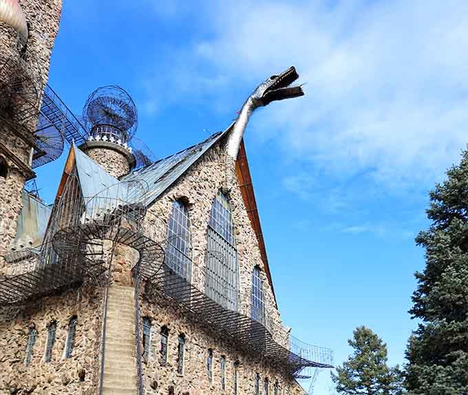 The fire-breathing dragon crowning the castle, because apparently building it wasn't dramatic enough without medieval special effects.