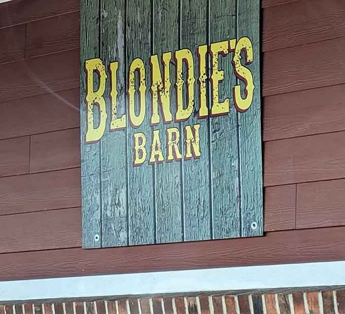 The weathered barn-style sign promises exactly what's inside: honest food served without pretense or apology.