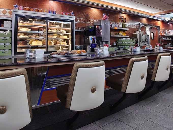 Counter seating offers front-row views of the kitchen magic and unlimited coffee refills for the wise observer.