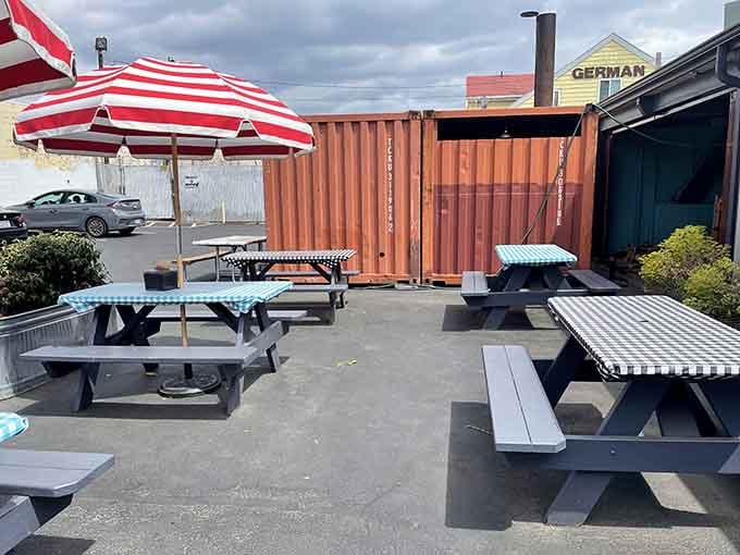 Picnic tables under striped umbrellas offer the perfect spot for enjoying barbecue in Portland's fresh air.