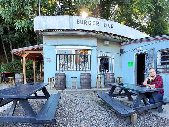 Picnic tables on gravel never looked so inviting, proving that the best dining experiences don't need fancy furniture or pretentious settings.