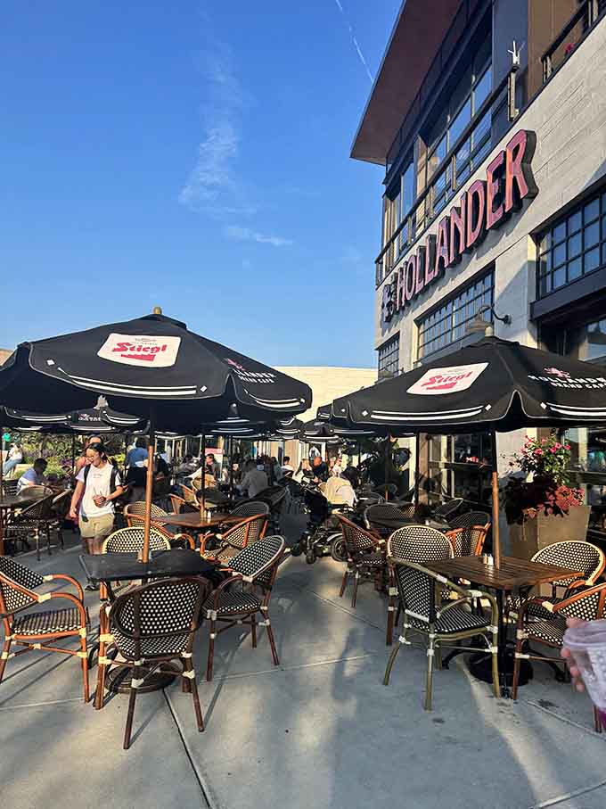 Outdoor seating under umbrellas makes you forget you're in a shopping center and not Brussels.