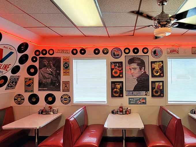 Booth seating adorned with Elvis and vintage records, where every meal comes with a side of rock and roll.