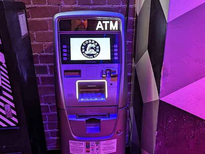 The ATM glows purple too, making it slightly less painful when you realize how much fun costs these days.