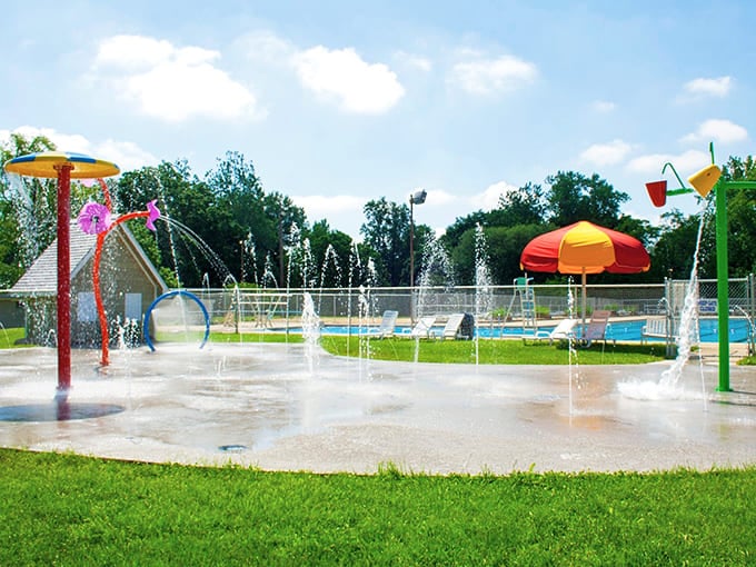 The splash pad offers summer relief that makes kids squeal with joy and parents grateful for outdoor entertainment.