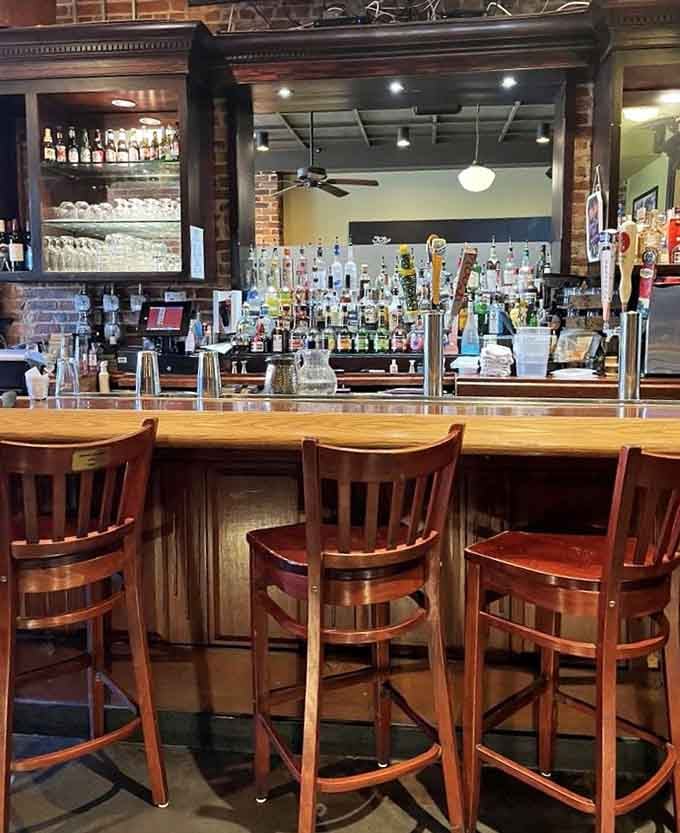 The bar area gleams with possibilities, offering liquid accompaniments to complement every soul food craving you might have.