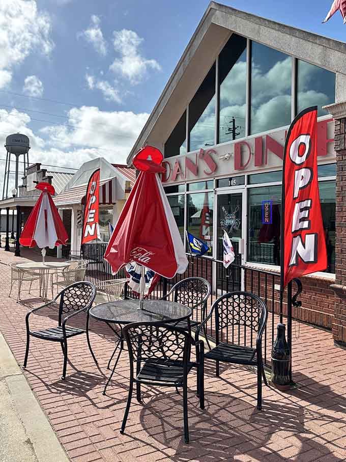 Outdoor seating with red umbrellas for when you want your retro dining experience with a side of Alabama sunshine.