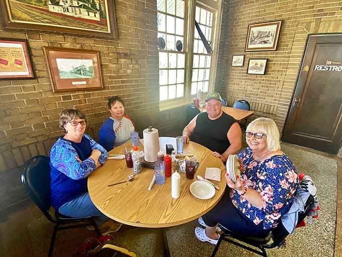 Happy diners gathered around a table of promise. At Wabash, strangers become friends, connected by the universal language of exceptional barbecue.