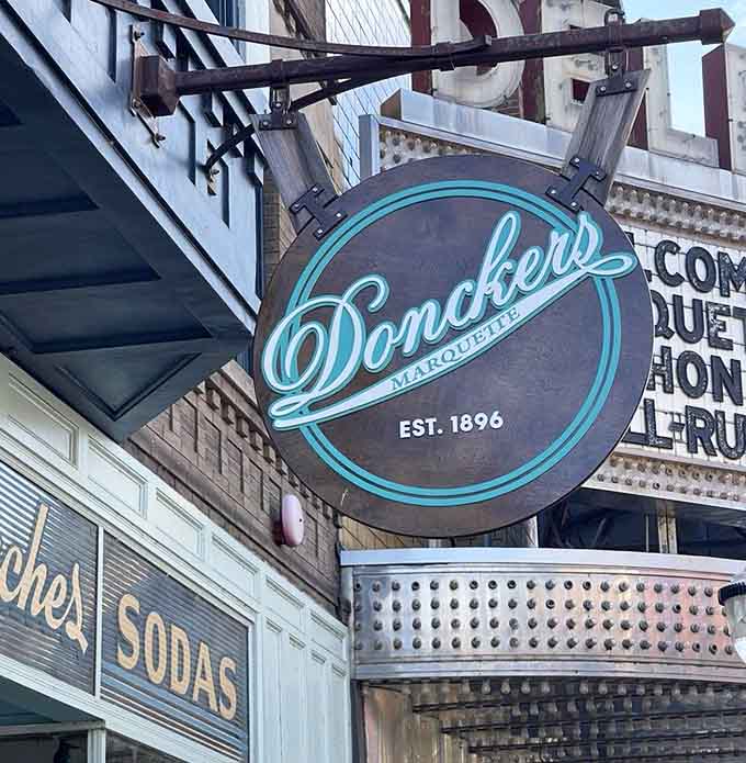 The round Donckers sign hanging proud since way back when, still drawing crowds like a delicious magnet.