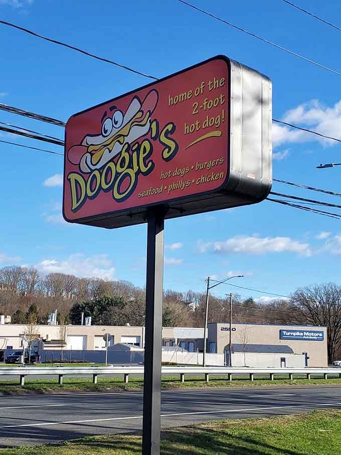 That cartoon hot dog on the sign isn't exaggerating, it's actually preparing you for what's coming next.