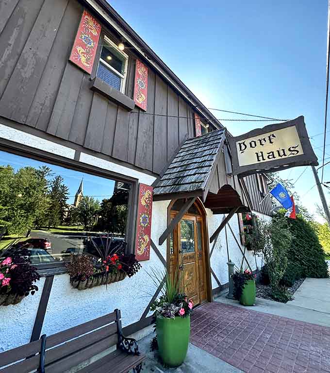 The entrance welcomes you with flowers and timber framing, promising an evening that transcends ordinary Tuesday night dining experiences.