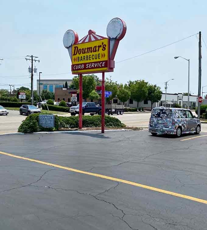 That vintage sign stands proud like a lighthouse guiding hungry travelers to salvation, one meal at a time.