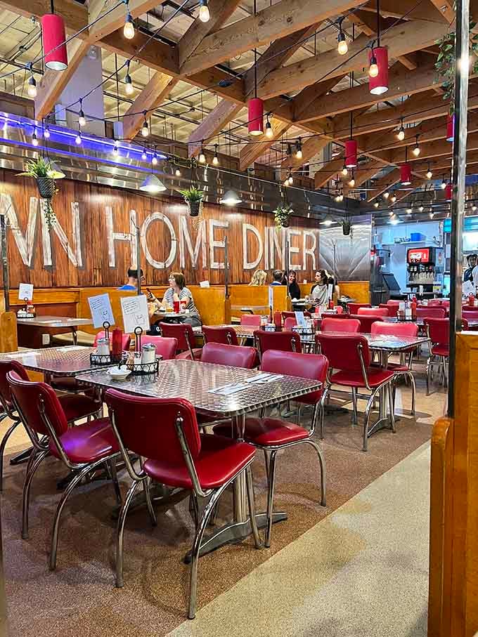 Warm wood tones and retro seating create an inviting atmosphere where everyone feels right at home immediately.