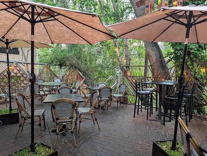 Shaded patio seating under umbrellas where you can savor tapas while watching downtown Prescott's charming street life.
