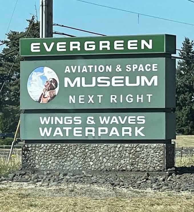 The roadside sign promises both aviation thrills and waterpark splashes, because why choose between flying high and getting wet?