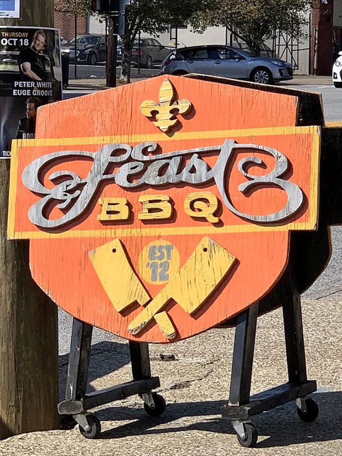 Hand-painted signage with vintage flair that says "serious about smoke" louder than any billboard ever could.