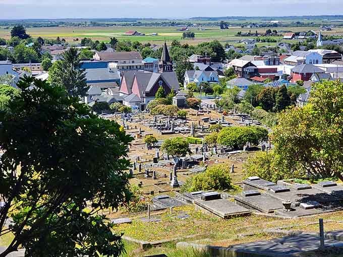 The cemetery overlook reveals the entire town below, pastoral and peaceful as a Sunday morning should be.
