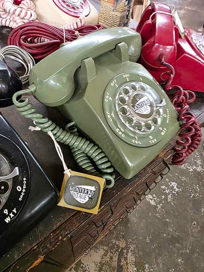 Rotary phones in avocado green and burgundy, reminding us when calling someone required actual finger strength and commitment.