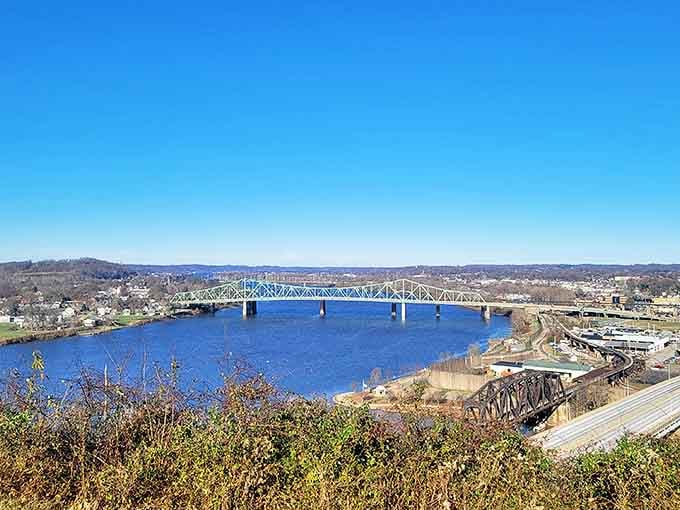 The Ohio River stretches blue and mighty beneath Fort Boreman's panoramic overlook. This breathtaking view explains why settlers chose this spot to build their futures.