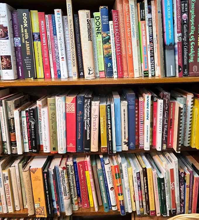 Books stacked like literary Jenga, where one wrong pull might avalanche decades of collected wisdom onto your shoes.