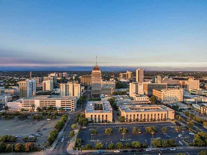 Fresno's downtown skyline stretches toward the Sierra Nevada, a city designed with breathing room—unlike its coastal cousins where buildings compete for every inch.
