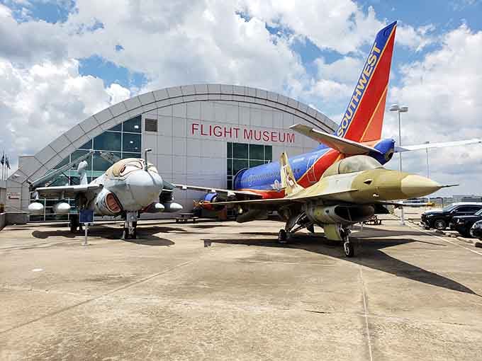Military jets parked outside stand sentinel, reminding visitors that aviation excellence requires constant innovation and courage.