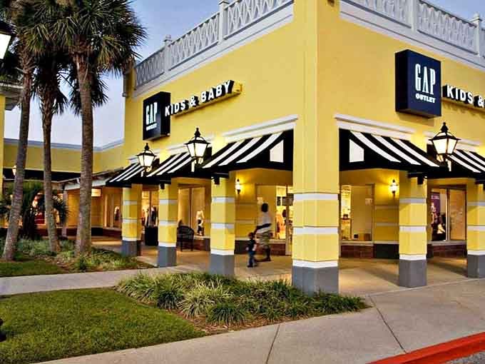 GAP Kids proves style starts young at Gulfport Premium Outlets. The manicured landscaping is almost as carefully curated as the tiny fashions waiting inside.