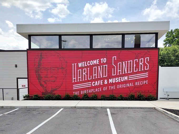 That bold red mural announces you've arrived at the birthplace of something much bigger than fried chicken.