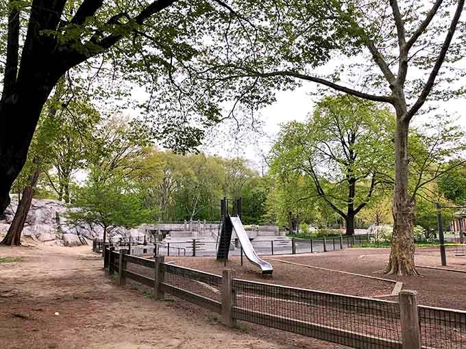 Tree-lined pathways and varied play equipment create a sprawling wonderland that keeps children entertained for hours on end.