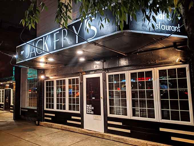 The illuminated storefront at night beckons like a beacon for anyone seeking exceptional food and timeless Louisville charm.