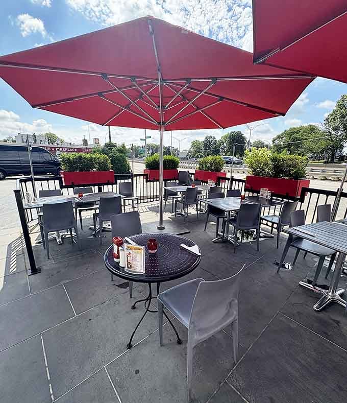 Outdoor seating where you can enjoy classic diner fare while watching East Elmhurst go by.