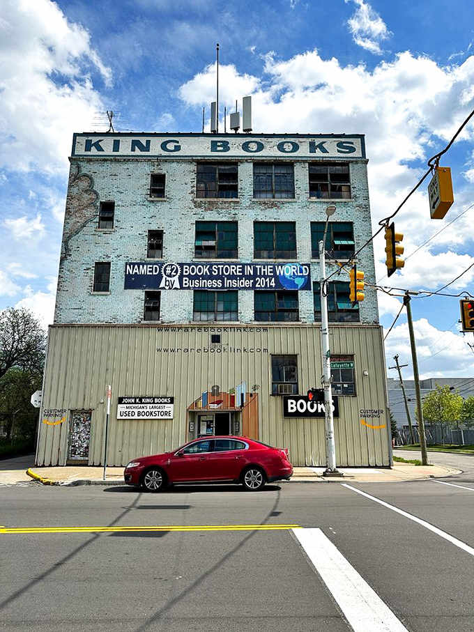 The exterior view reveals the building's impressive scale&mdash;a former factory now dedicated to manufacturing joy instead of gloves.